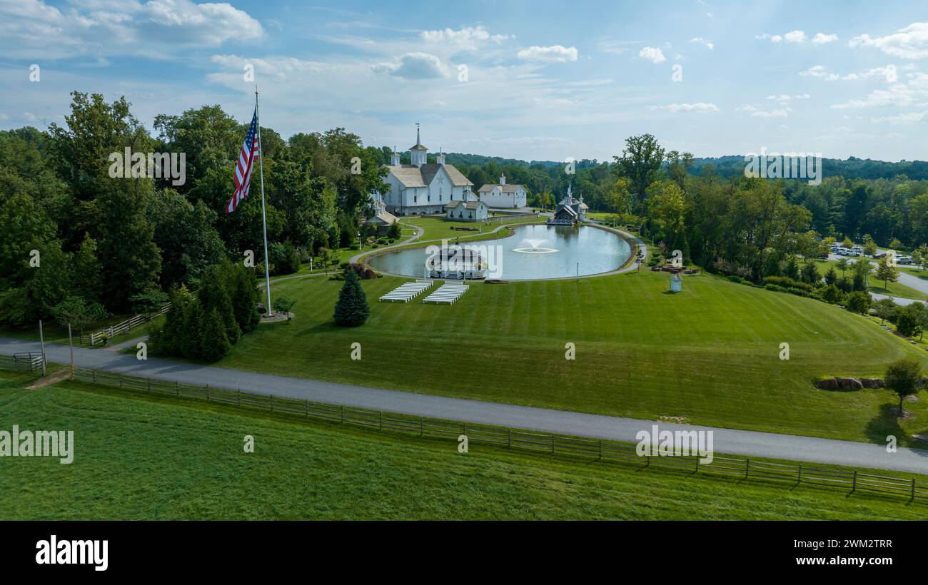 Aerial View Of A Grand White Building With A Grey Roof Surrounded By ...