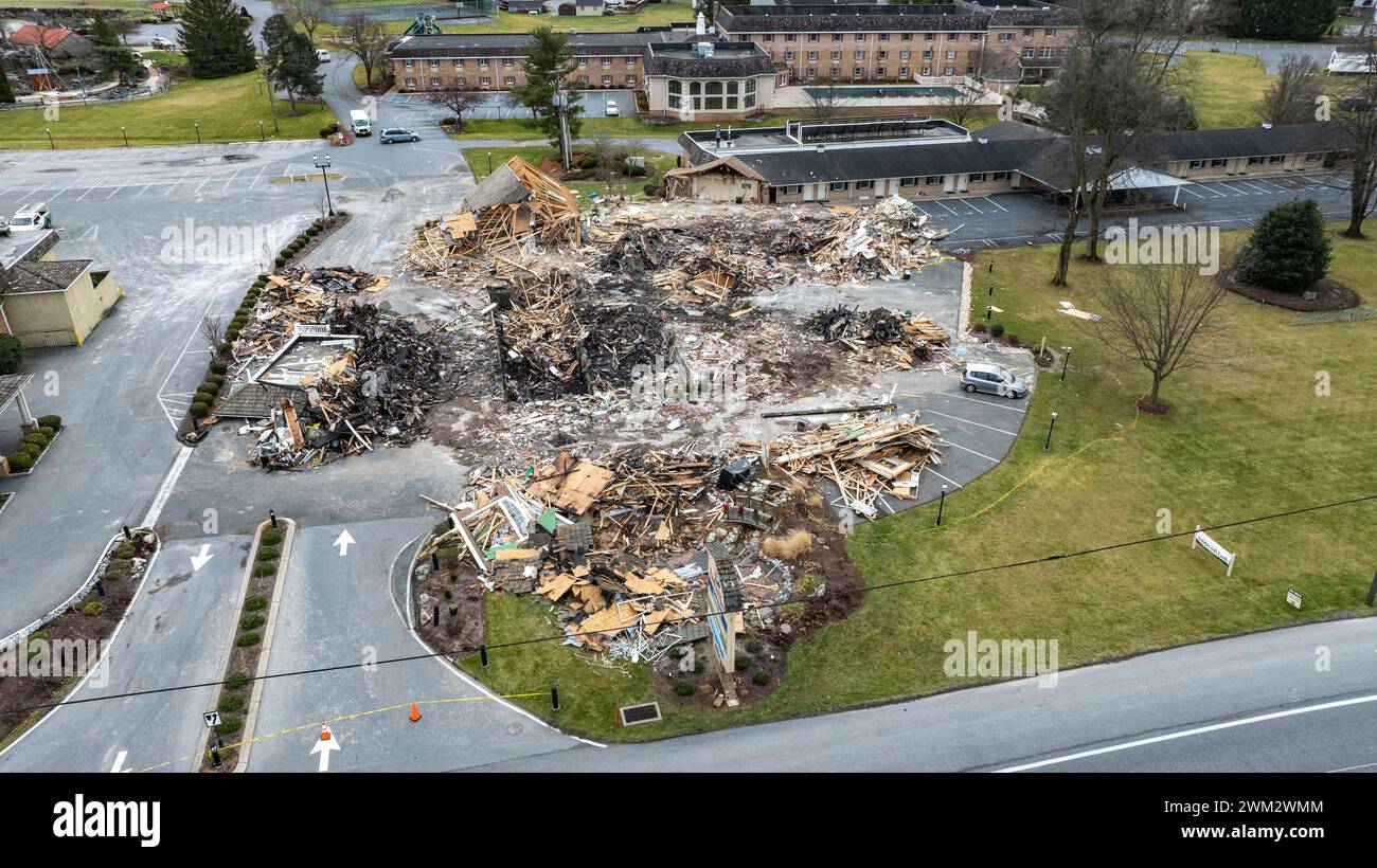 An Aerial View Of A Devastated Building Amidst Intact Structures With ...