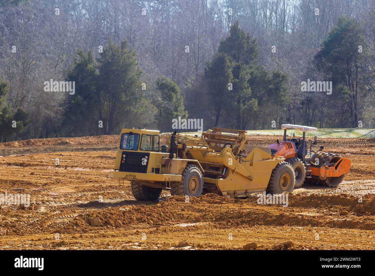 It is evident that heavy equipment is working on construction site in ...