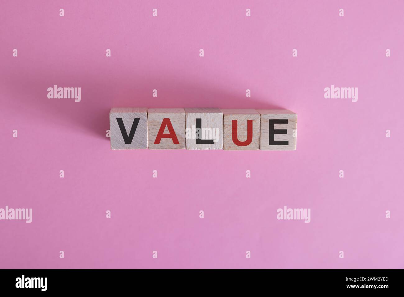 Value symbol. Concept word value on wooden cubes. Businessman hand ...