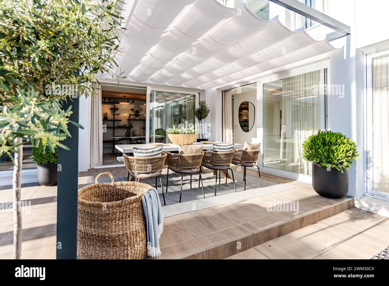 a luxury outdoor dining table in the garden of a mediterranean mansion ...