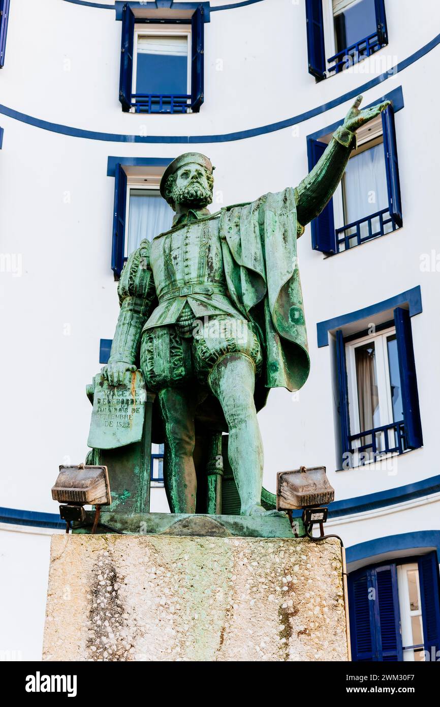Bronze sculpture of Juan Sebastián Elcano, born in Getaria, in front of ...