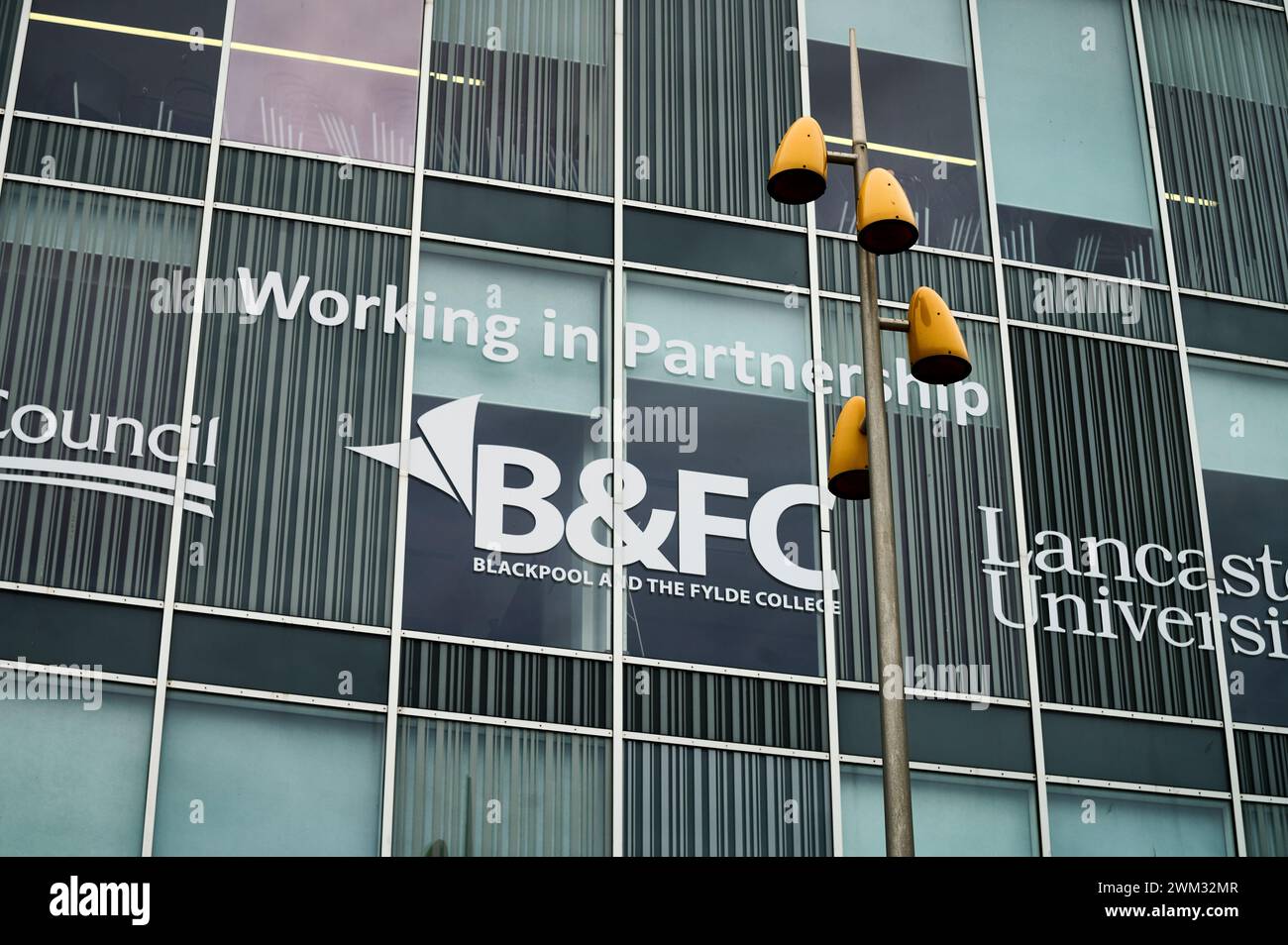 Working in partnership signs on council building windows Stock Photo ...