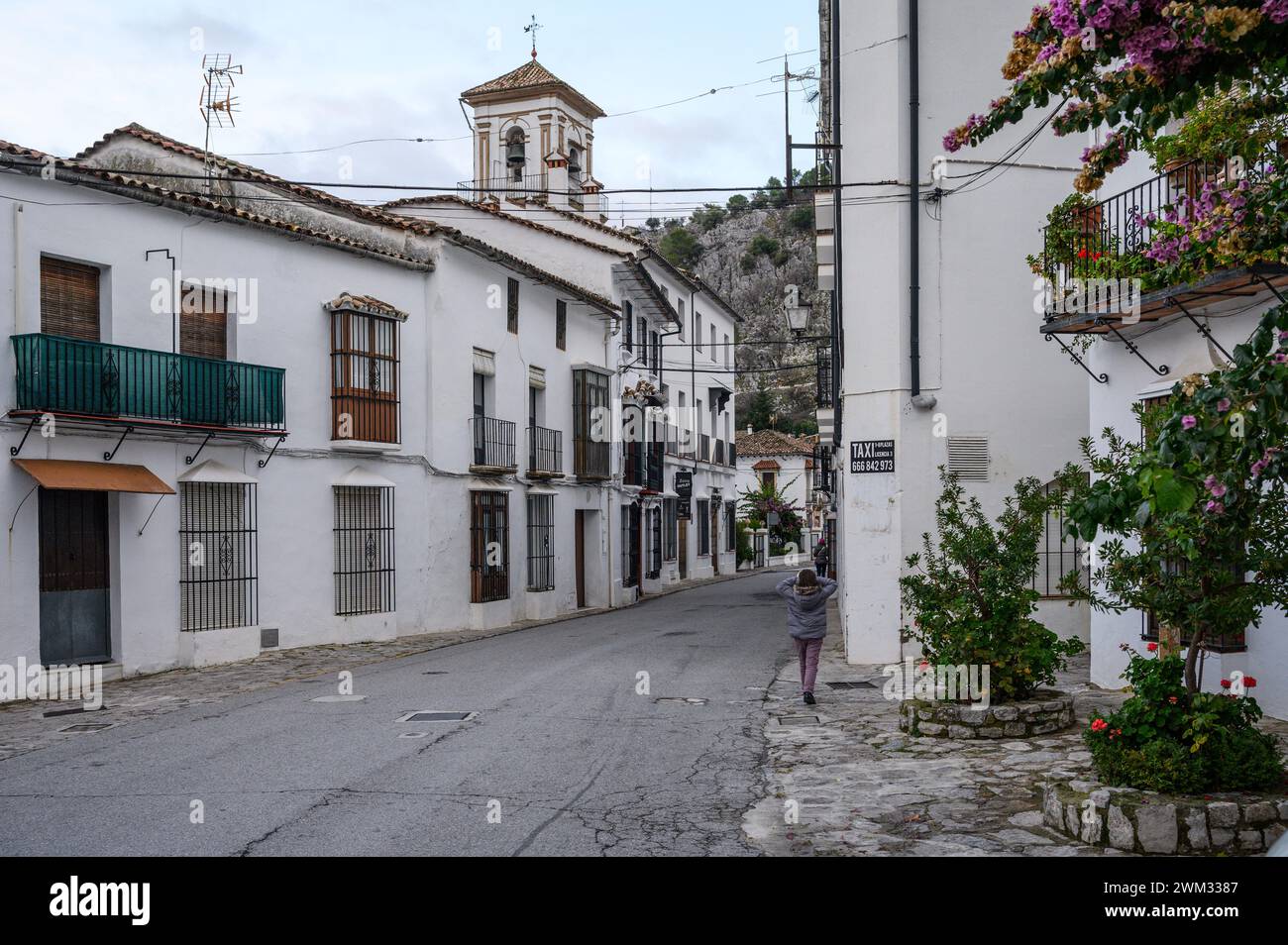 Typical narrow and very pretty streets of an Andalusian village with ...