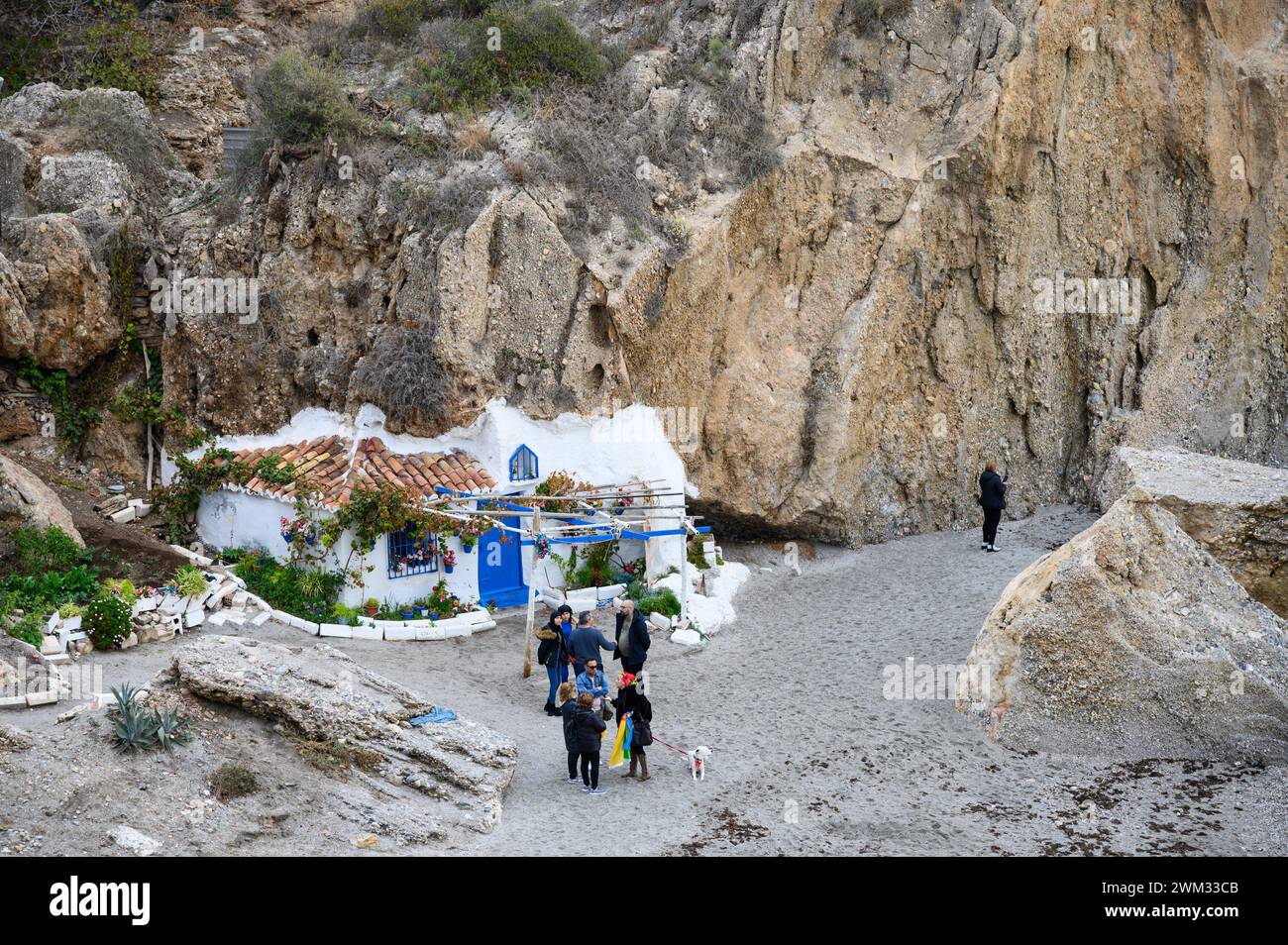 Don Ducano's House embedded in the rock with typical blue door and ...