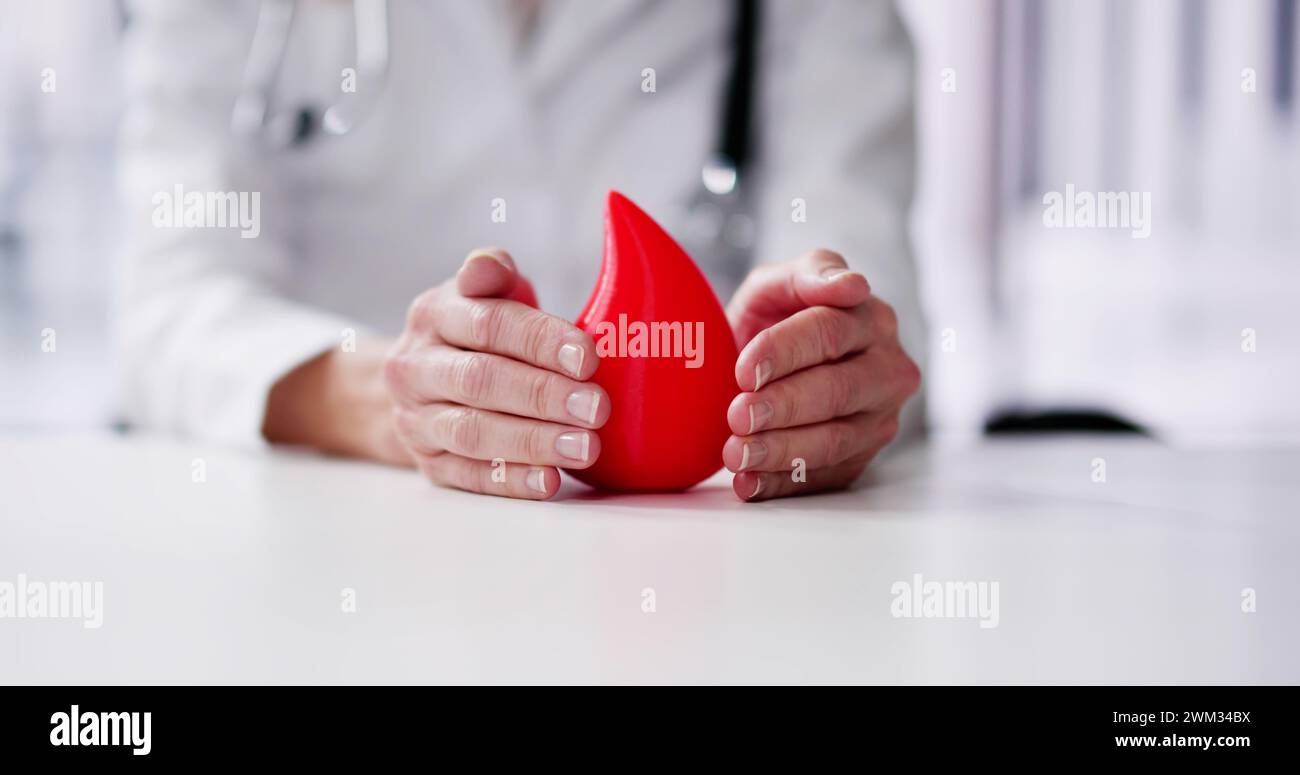 Hemophilia World Day. Doctor With Donor Blood Drop Stock Photo - Alamy