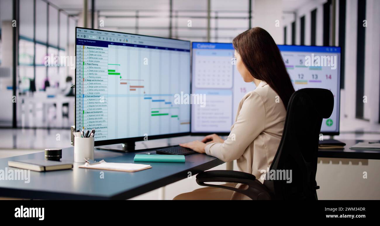 Woman Working On Calendar Agenda Schedule On Computer Stock Photo - Alamy