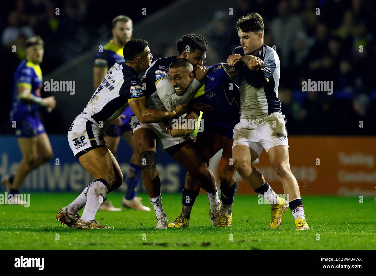Warrington Wolves' Paul Vaughan is tackled during the Betfred Super ...