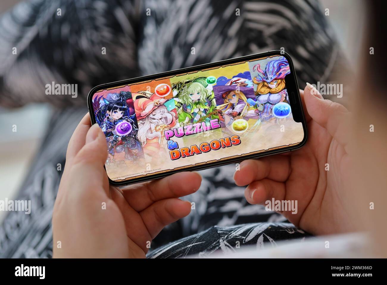 Puzzle and dragons mobile iOS game on iPhone 15 smartphone screen in ...