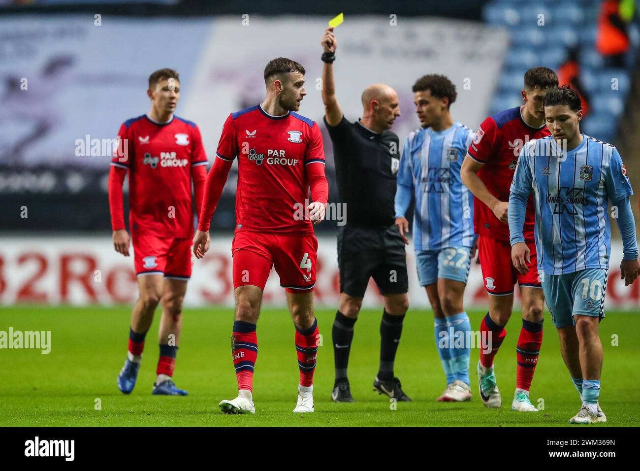 Ben Whiteman of Preston North End is shown a yellow card by referee ...