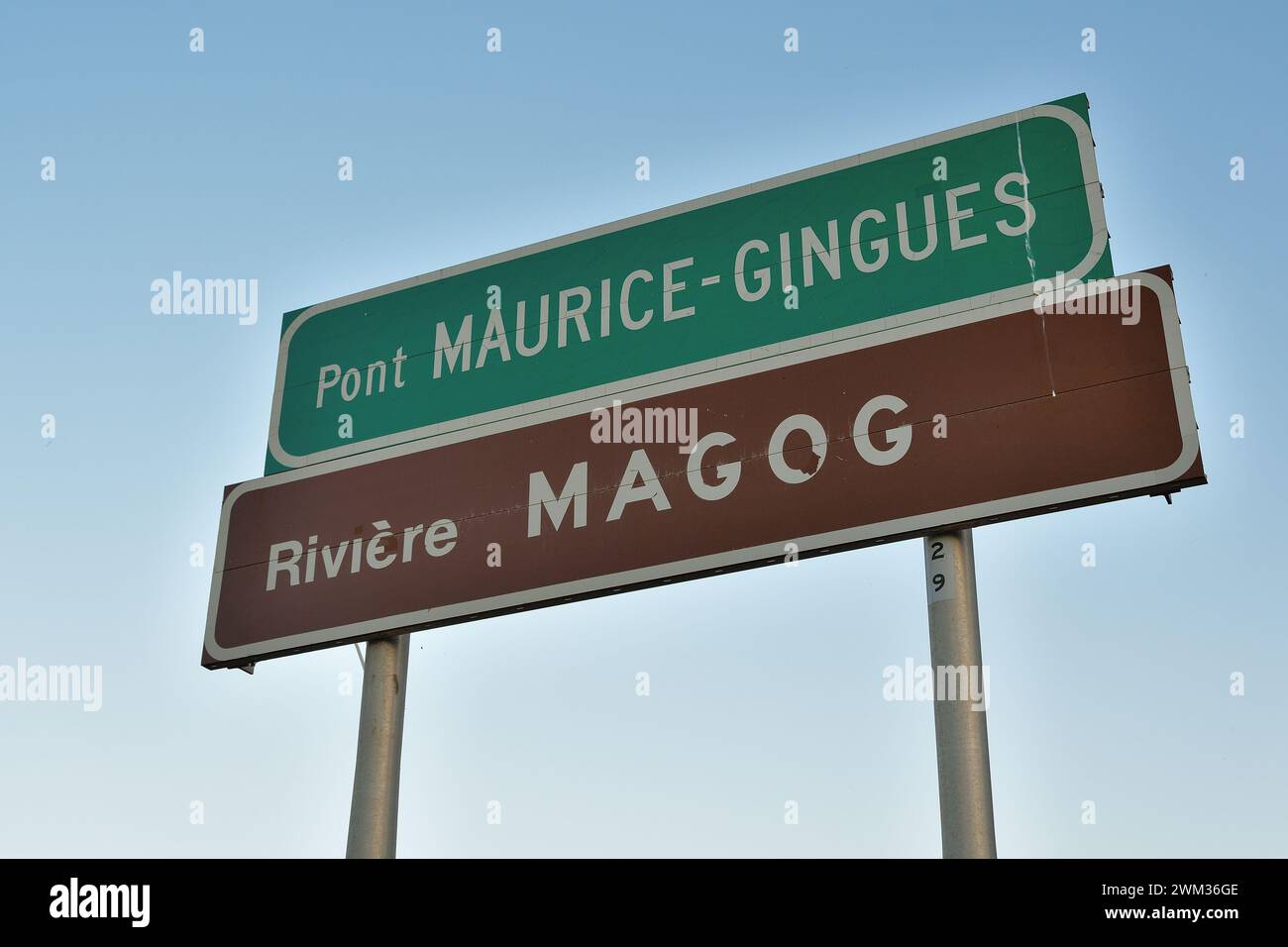 Magog river and Maurice-Gingues bridge signs Stock Photo - Alamy