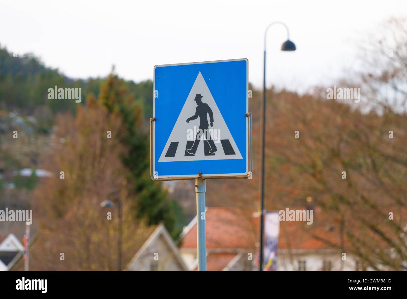 Pedestrian crossing sign with a man with a hat Stock Photo - Alamy