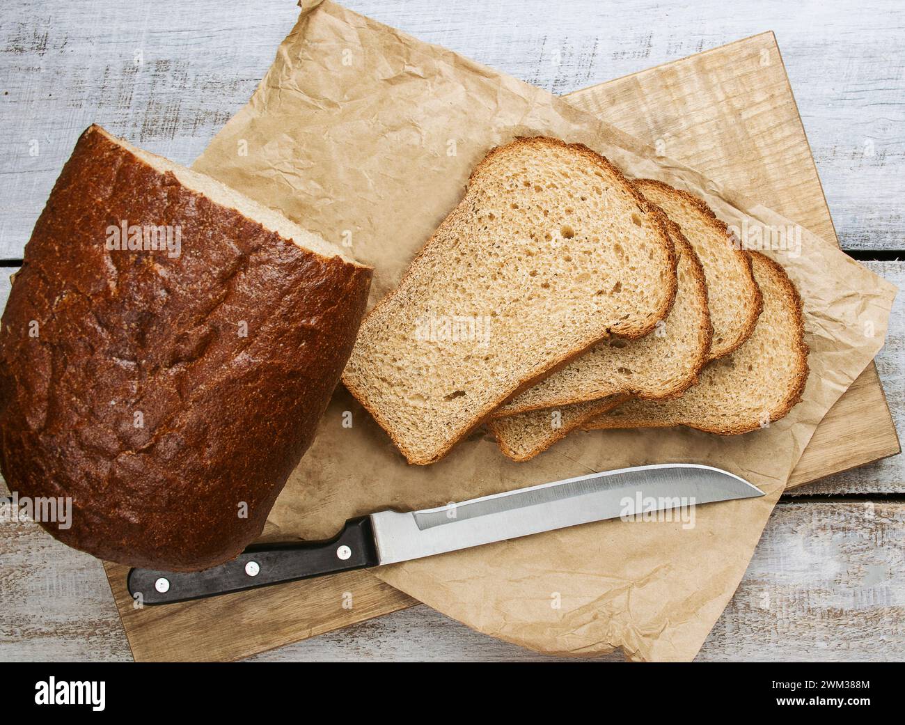 Concept of traditional leavened bread baking methods. Sliced whole ...