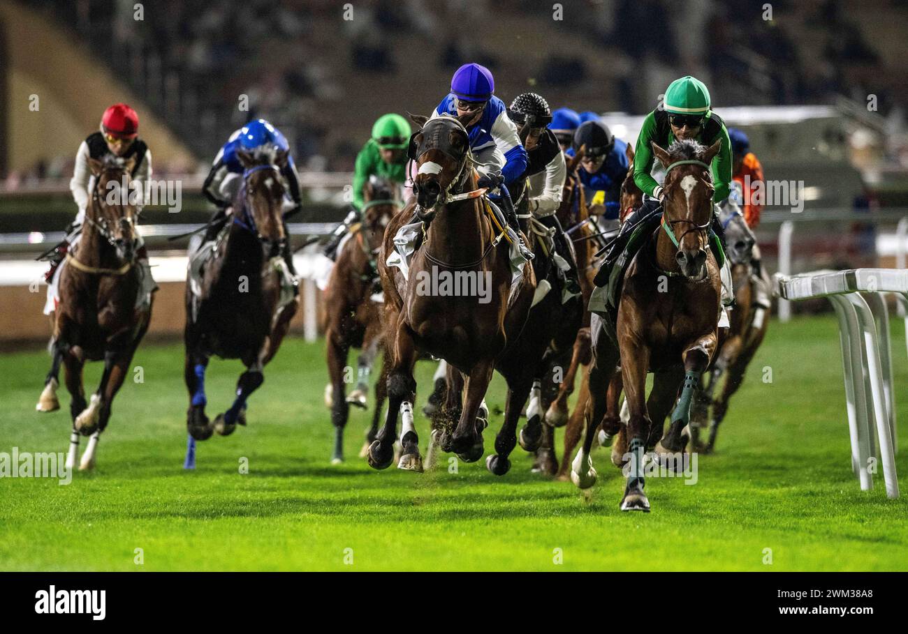 Horses gallop into the first turn in Invest Saudi International Jockey ...