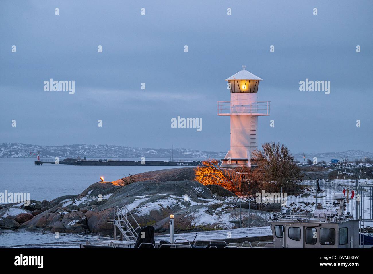 Small white lighthouse by the harbour Stock Photo - Alamy