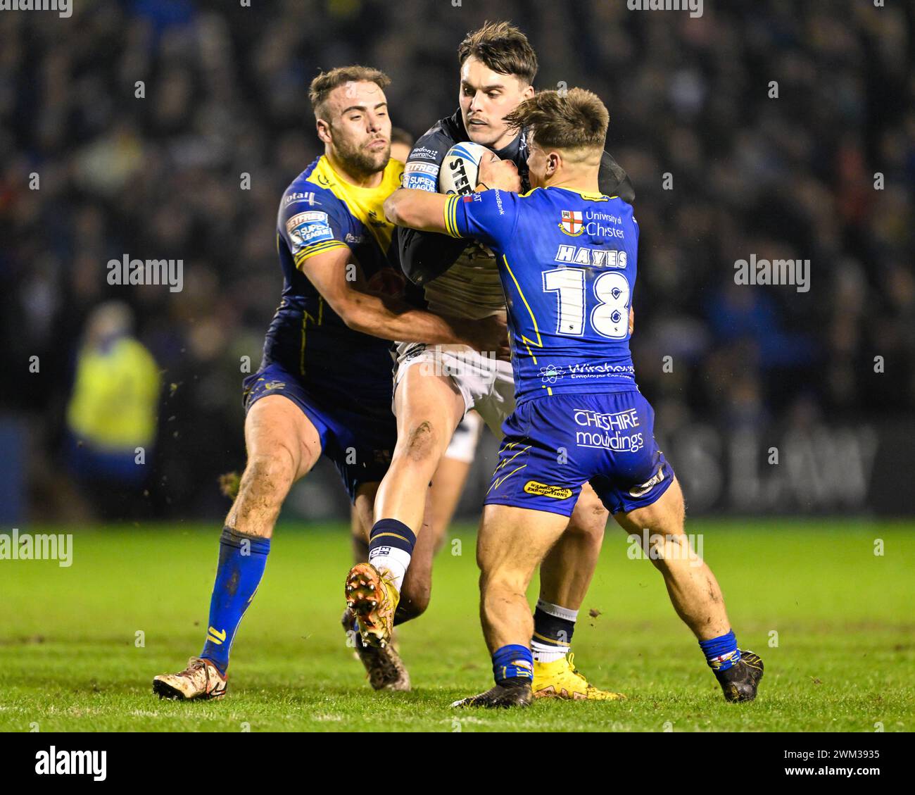Warrington, UK. 23rd Feb, 2024. Jordan Lane Hull FC is tackled by Leon ...