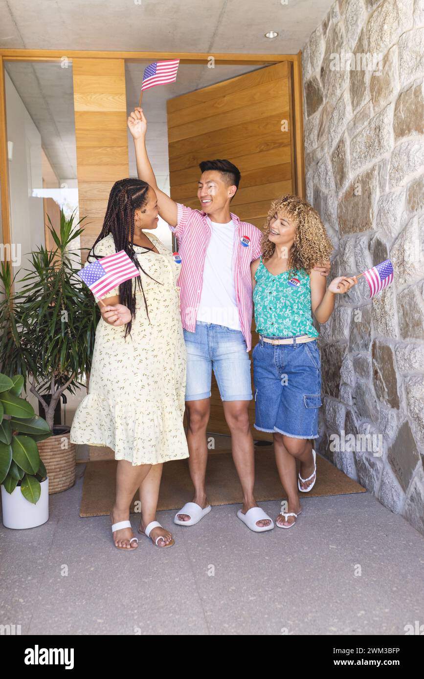 Diverse friends celebrate outdoors wearing vote badges Stock Photo - Alamy