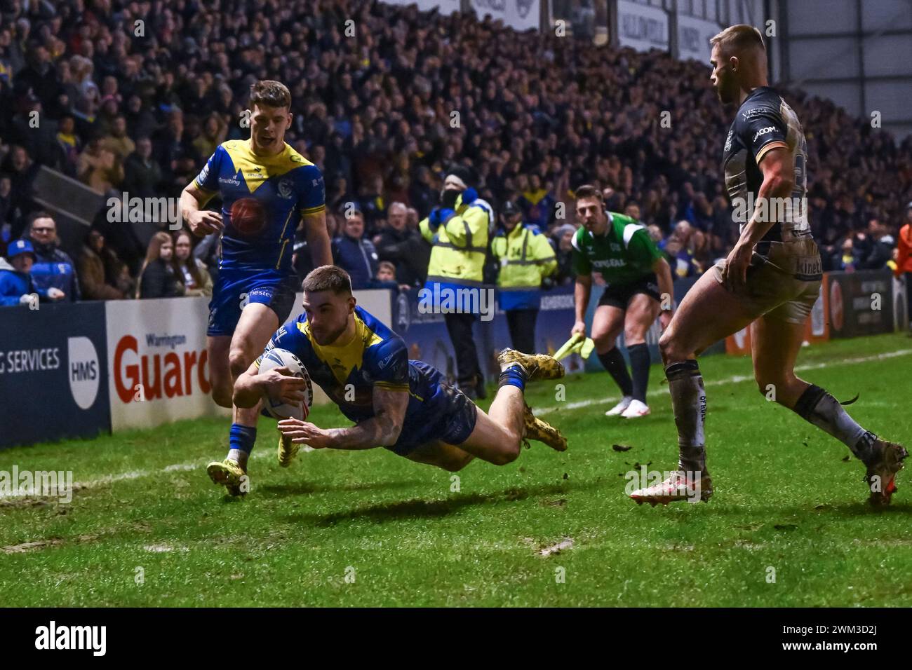 Connor Wrench of Warrington Wolves goes over for a try during the ...