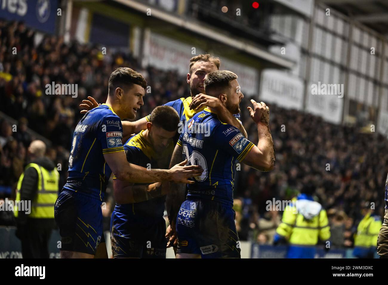 Connor Wrench of Warrington Wolves celebrates his try during the ...