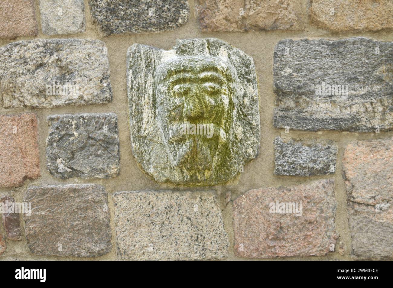 Engravings and bas-reliefs depicting grotesque human and devil masks on ...