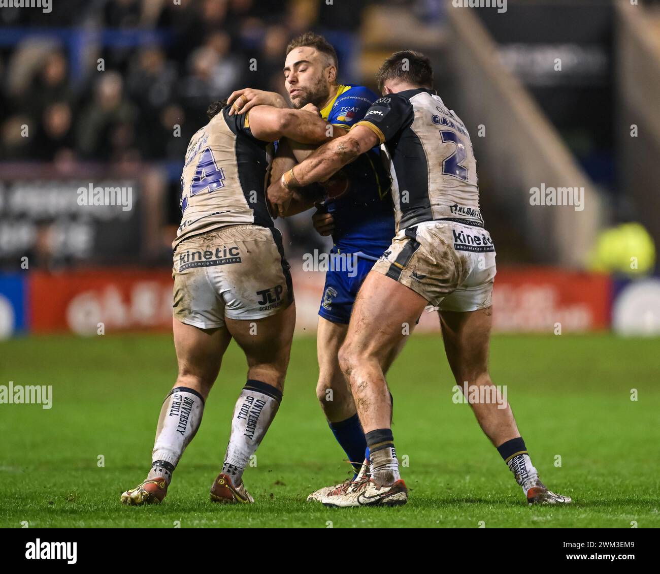 James Harrison of Warrington Wolves is tackled by Liam Tindall Hull FC ...