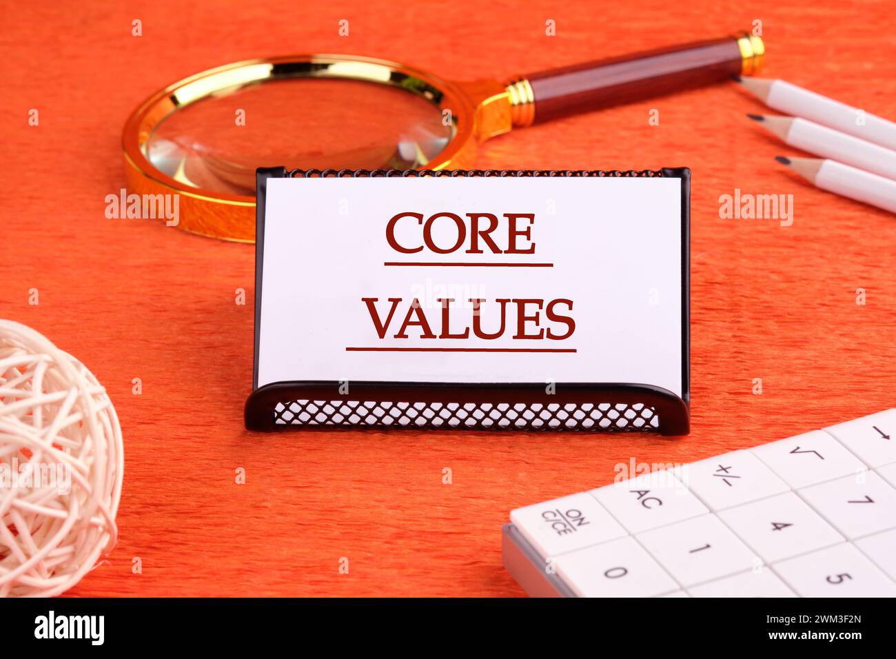 CORE VALUES word written on a white business card on a stand on an ...