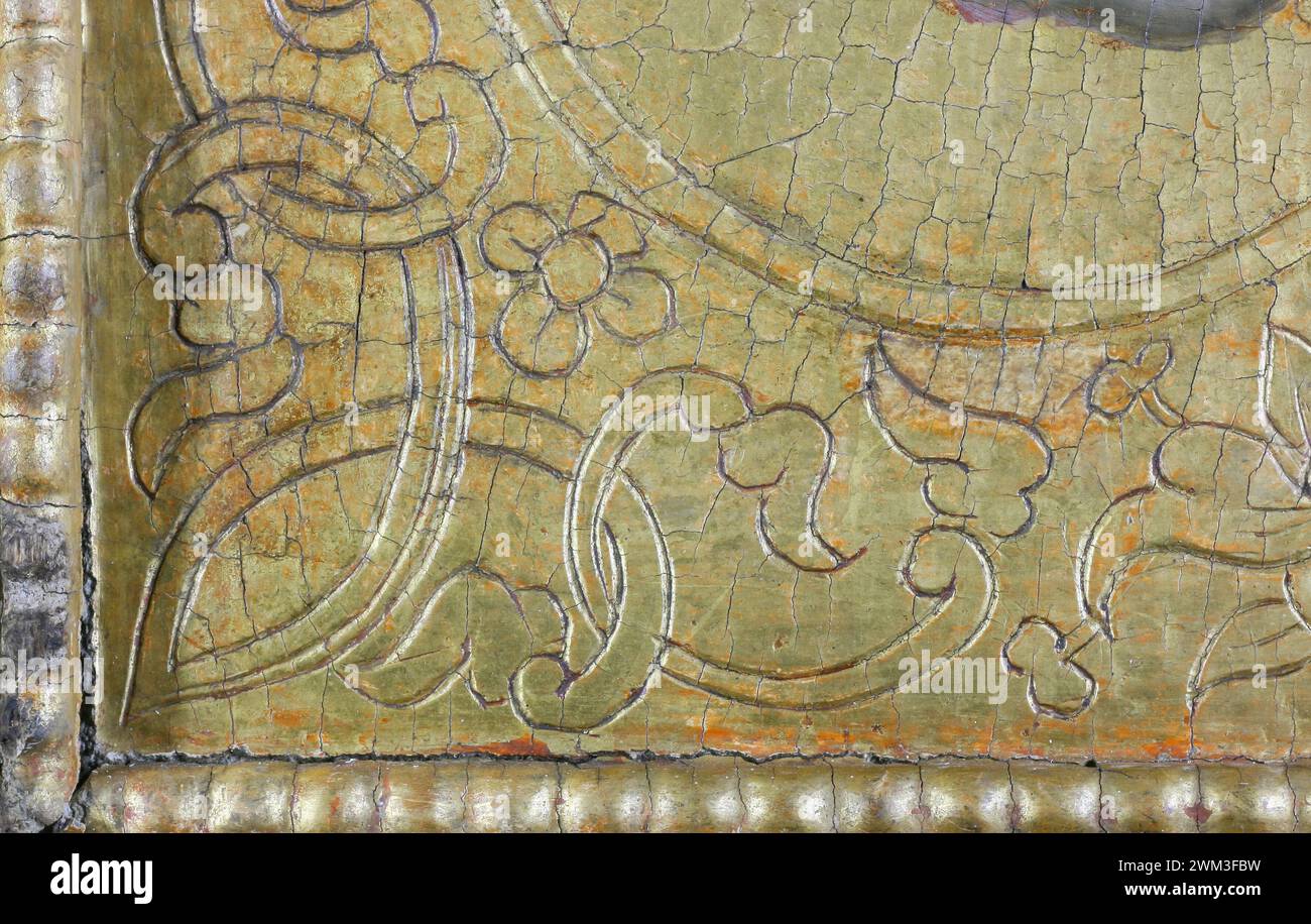 gold with carvings on the old icon. restoration of the icon, gold ...