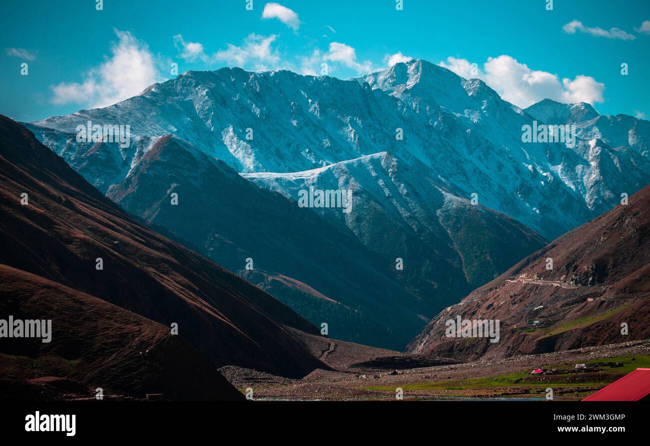 Beautiful mountainous landscape with ice capped mountains and luscious ...