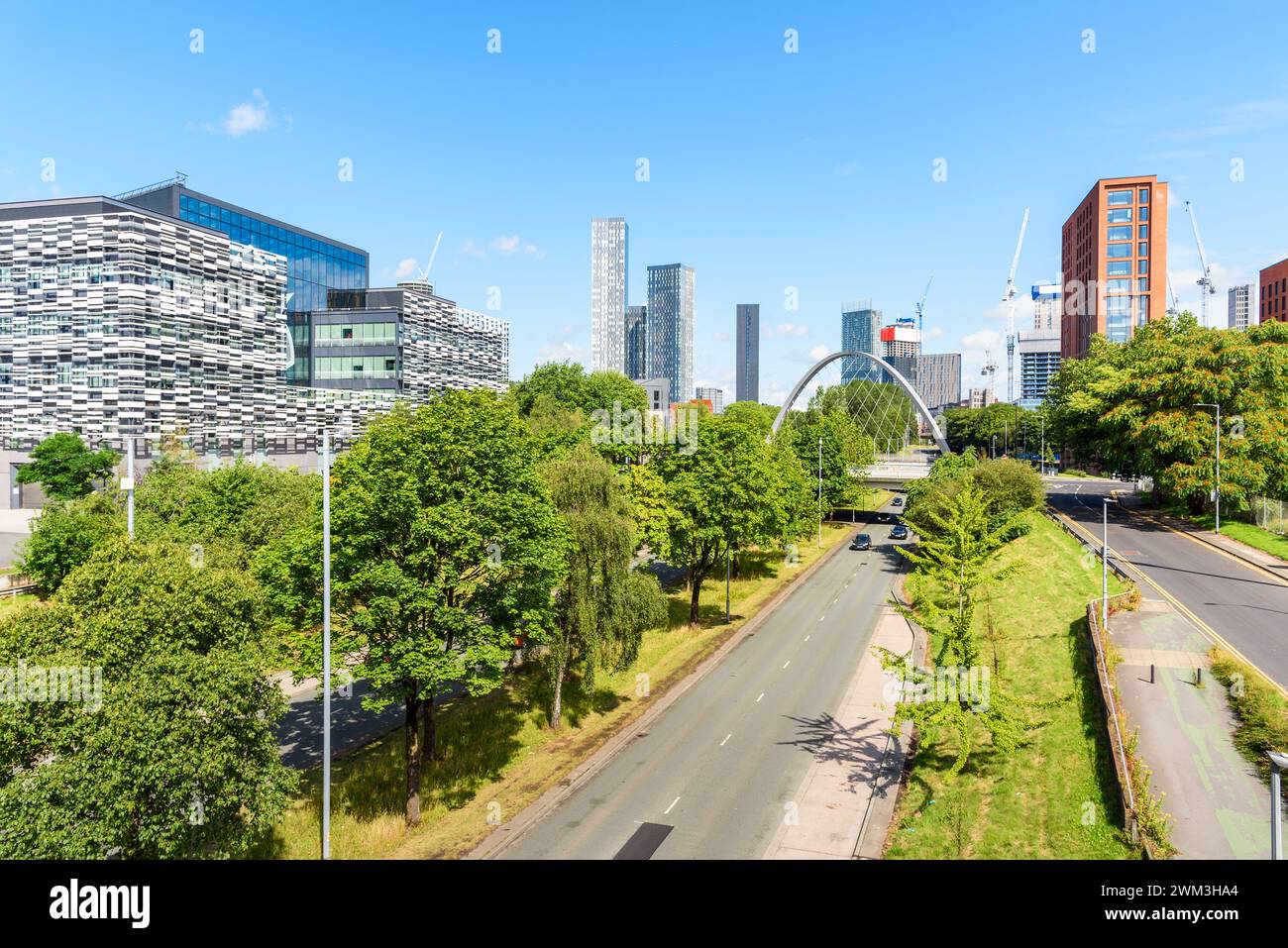 Manchester skyline as seen from Princess street on a sunny summer day ...