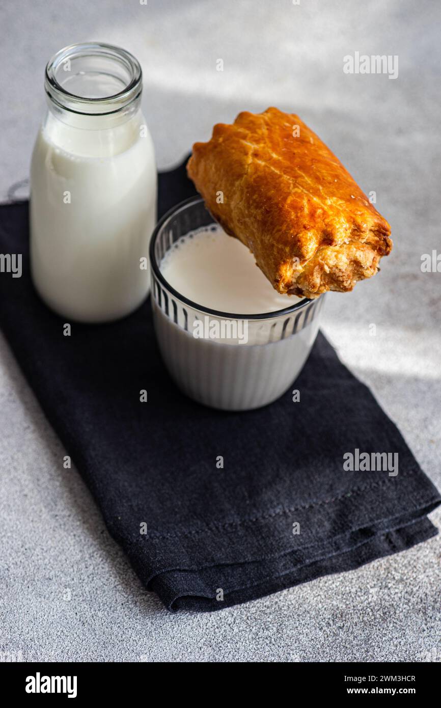 Sweet pastry on the table with milk Stock Photo - Alamy