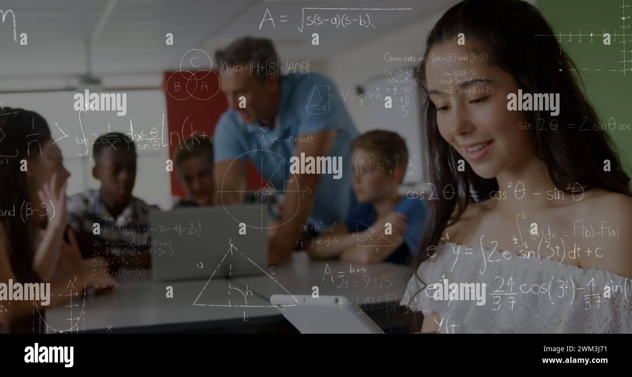 Image of mathematical equations over school children using laptop and ...