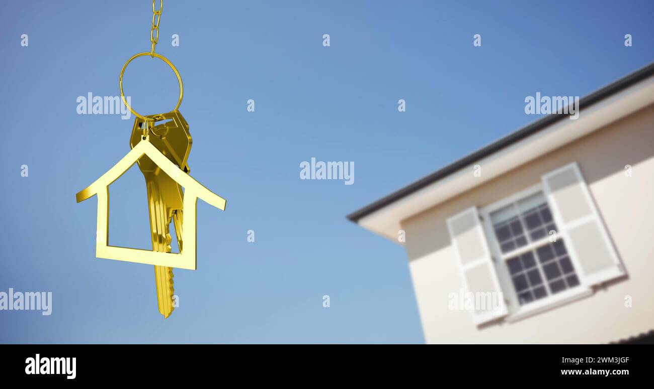 Image of golden house keys and house shaped key fob hanging over a ...