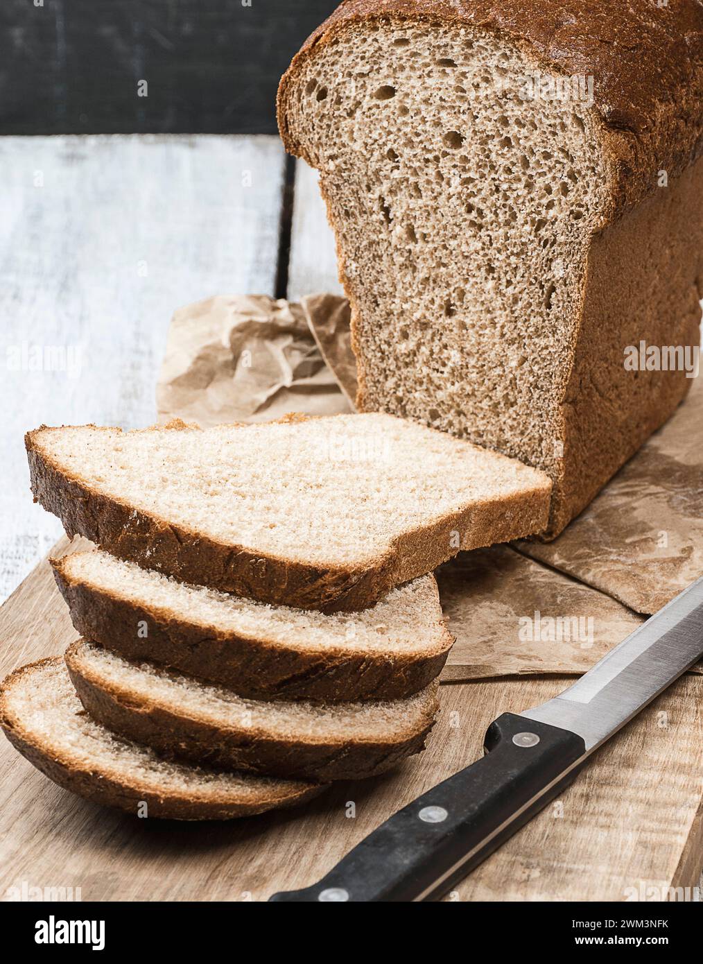 Concept of traditional leavened bread baking methods. Sliced whole ...