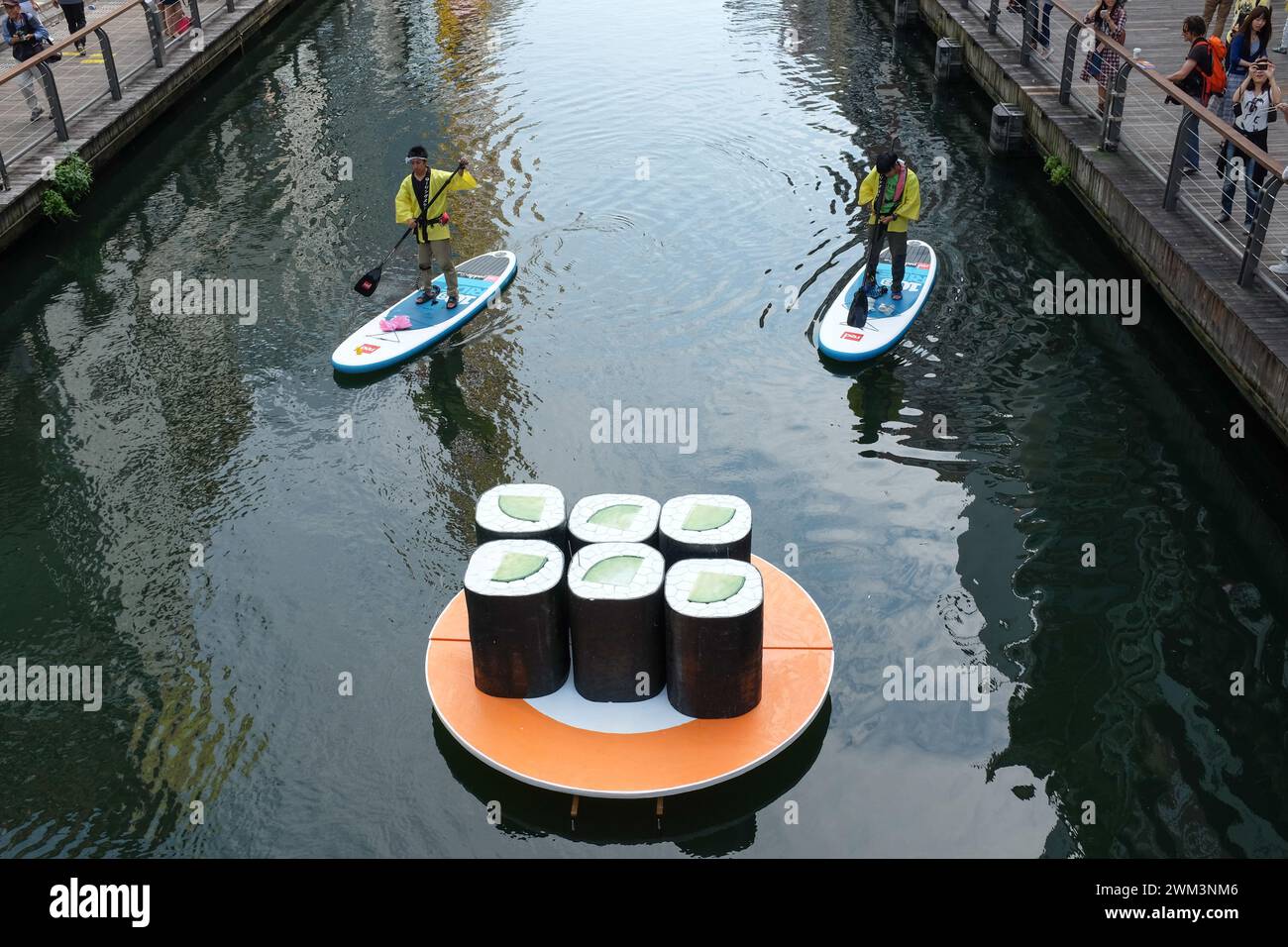 Giant models of sushi floating along the Dotonbori canal in Namba ...