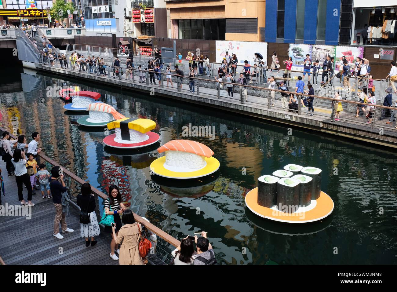 Giant models of sushi floating along the Dotonbori canal in Namba ...