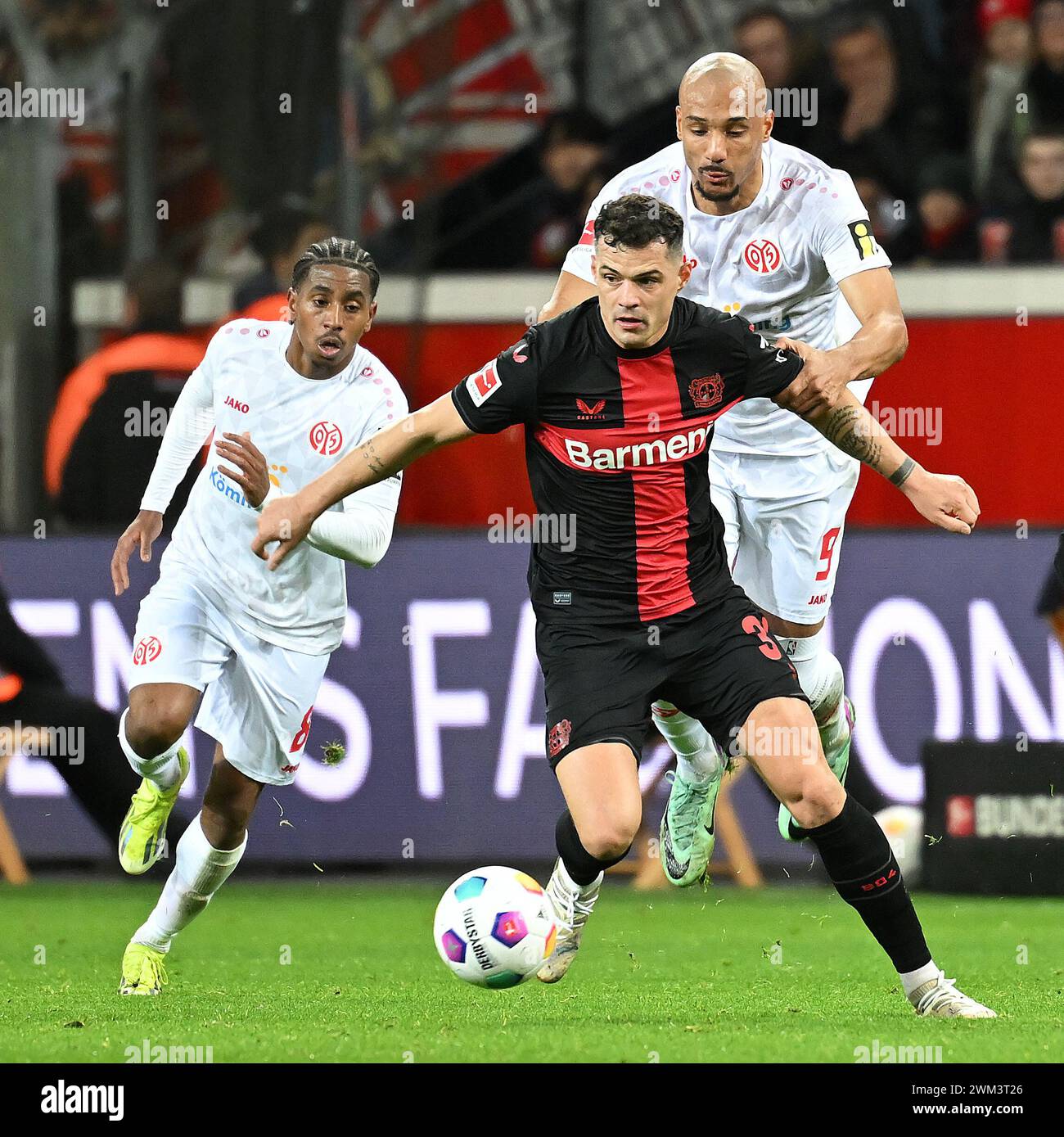 Leverkusen, Germany. 23rd Feb, 2024. Granit Xhaka (C) of Bayer 04 Leverkusen breaks through ...
