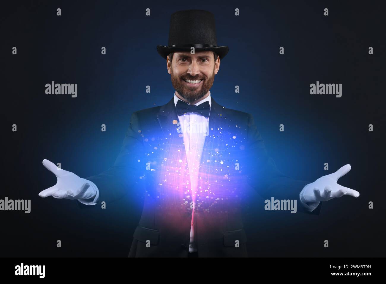 Magic and sorcery. Magician with fantastic light on dark background ...