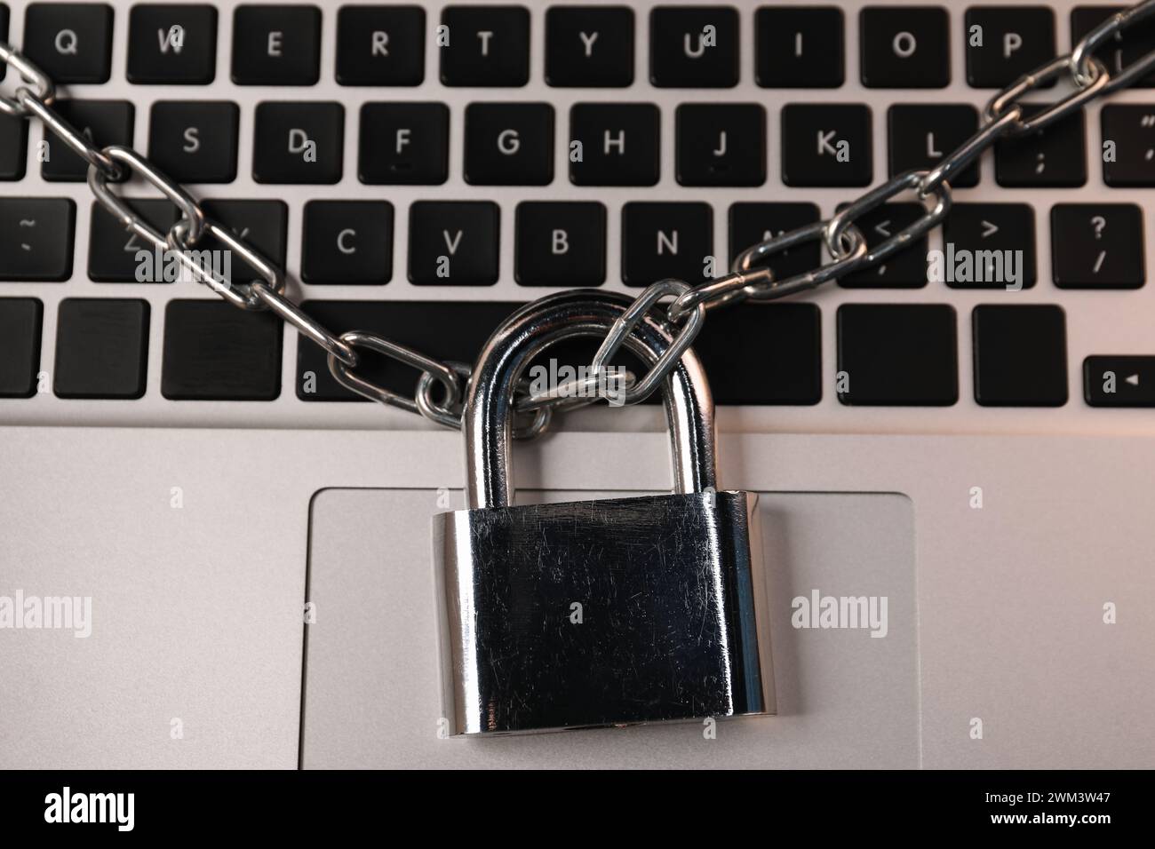 Cyber security. Padlock with chain on laptop, top view Stock Photo - Alamy