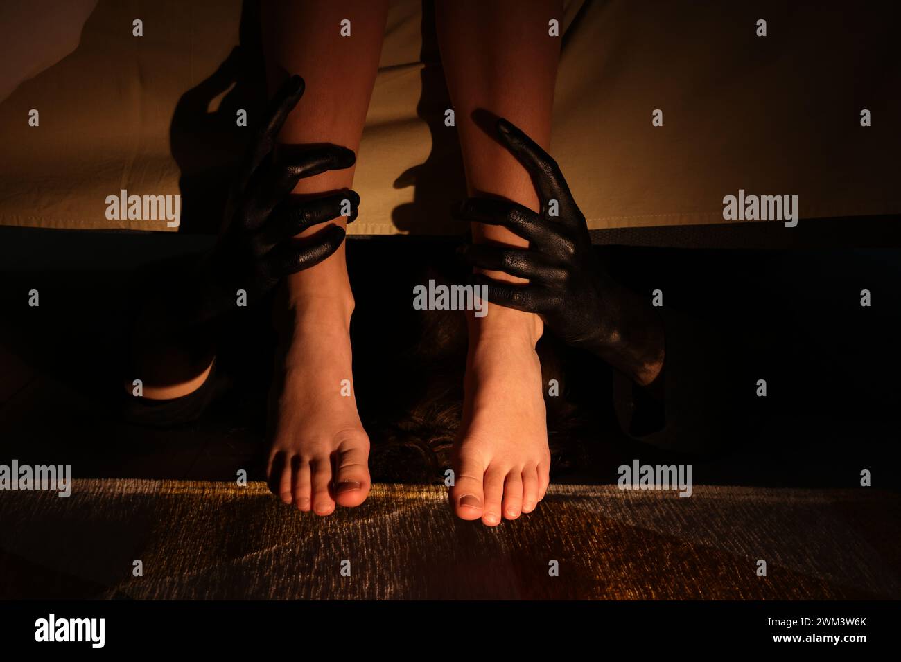 Scary monster under bed grabbing little girl by legs, closeup Stock ...