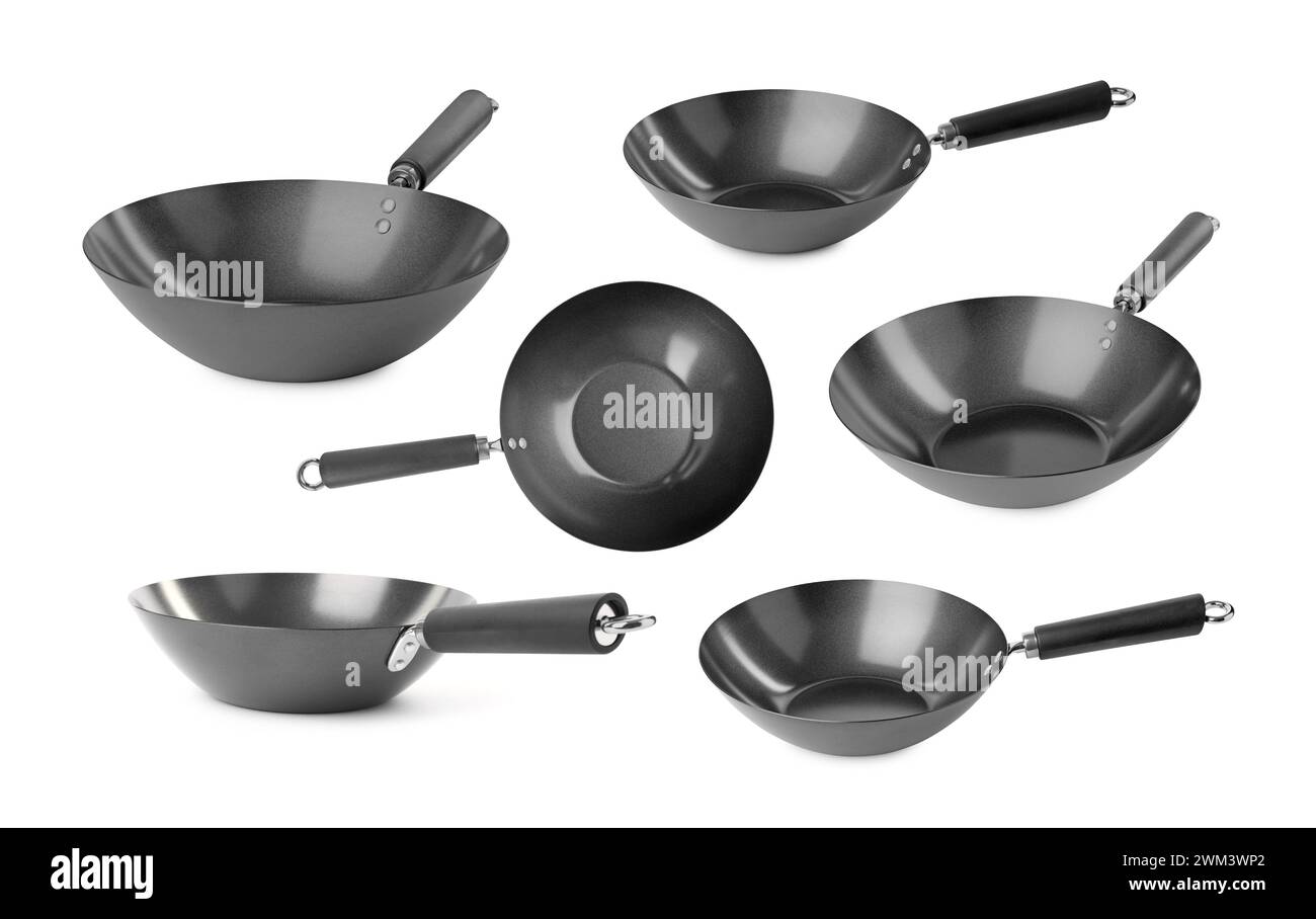 Empty metal woks isolated on white, set Stock Photo - Alamy