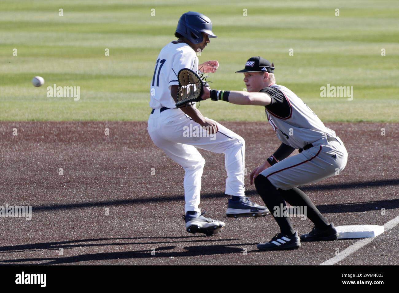 Oral Roberts' Alex Rodgers (11) runs to first base against SIEU's Ethan ...