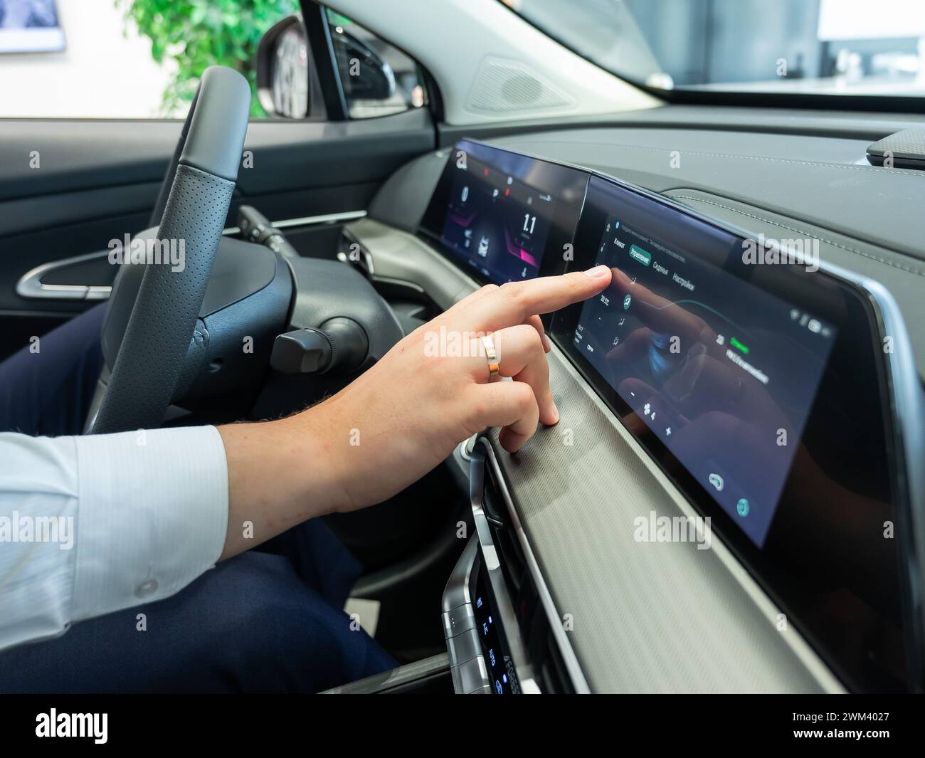 Close-up of a man's hands on the dashboard of a modern car Stock Photo ...