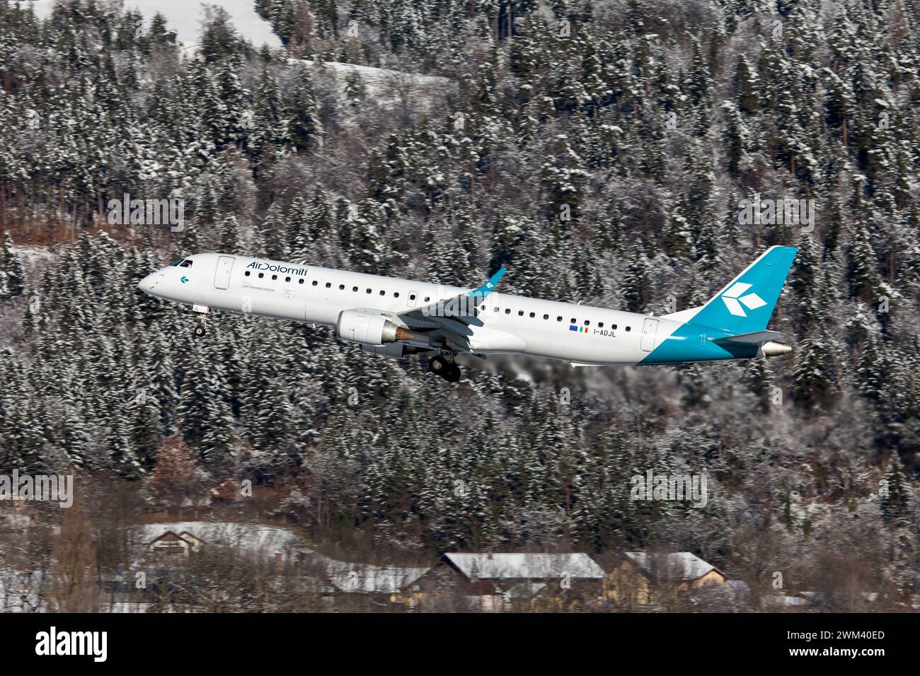 An Air Dolomiti Embraer 190 taking off from Innsbruck-Kranebitten ...