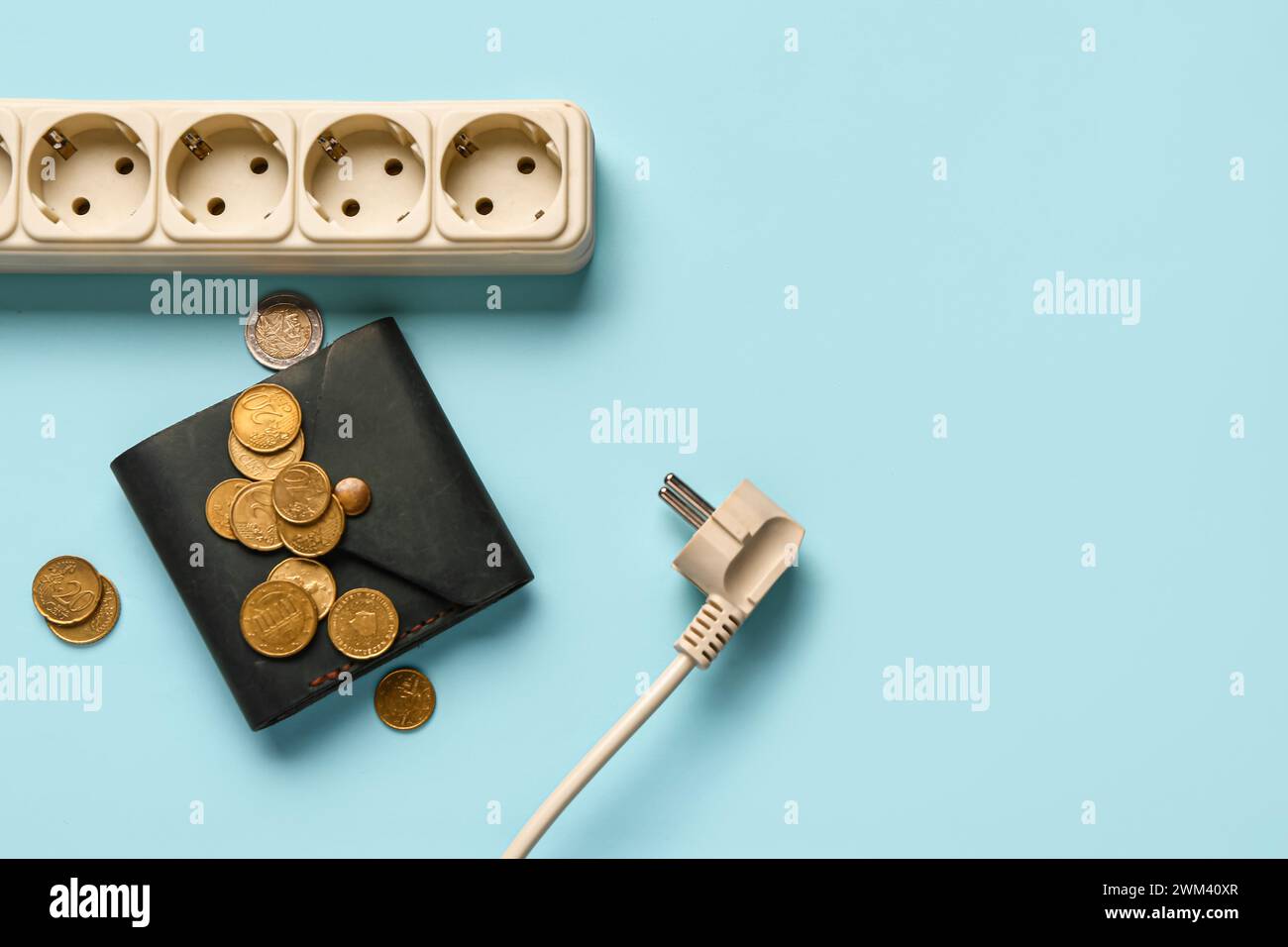Wallet with coins, power socket and plug on blue background ...