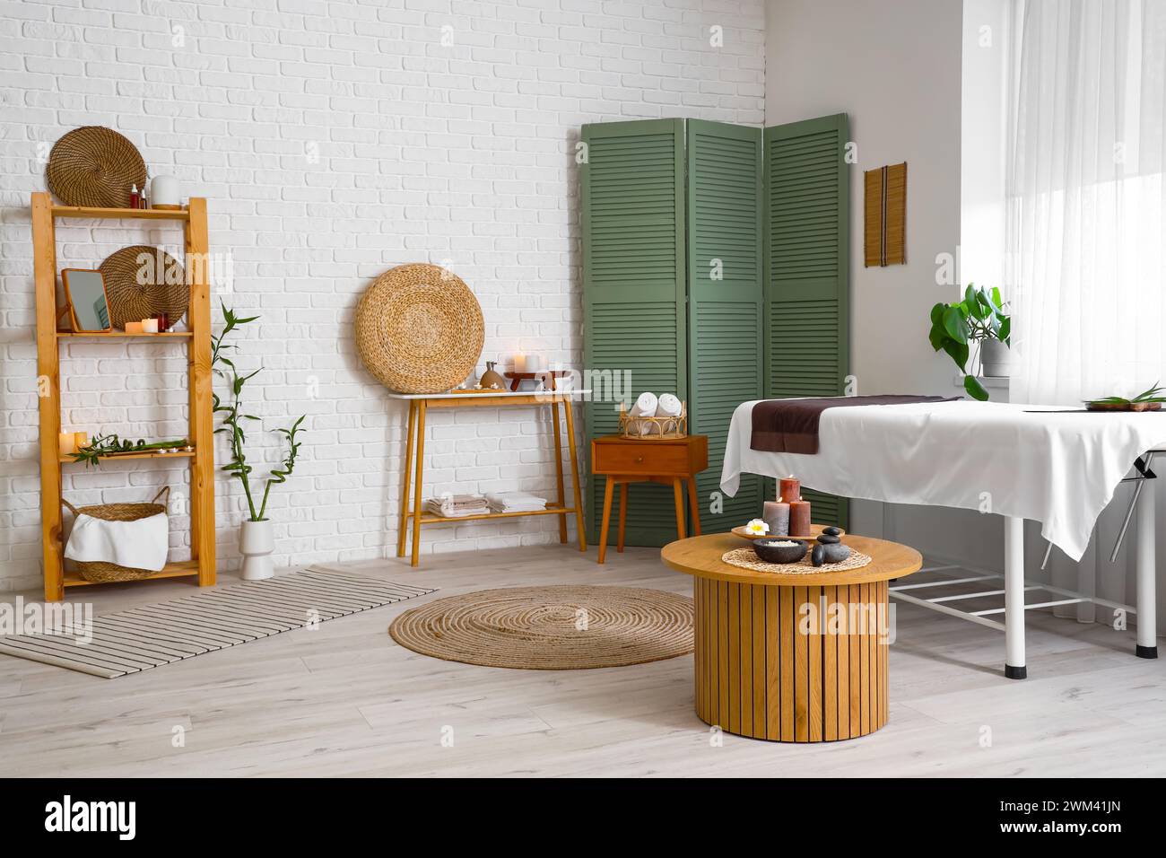 Interior of spa salon with couch and shelf units Stock Photo - Alamy