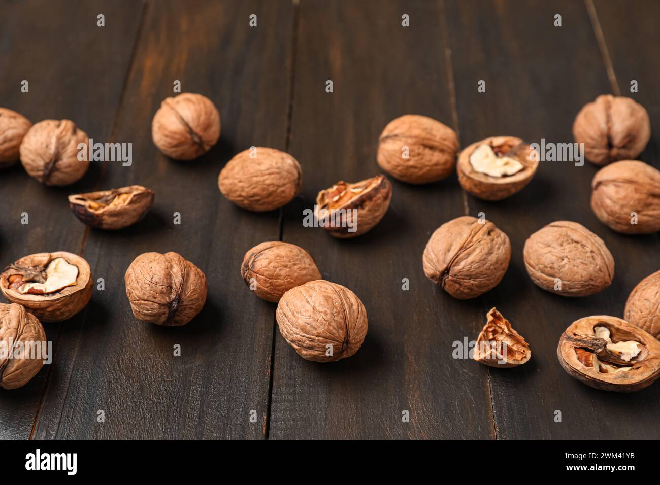 Natural walnuts on wooden background Stock Photo - Alamy