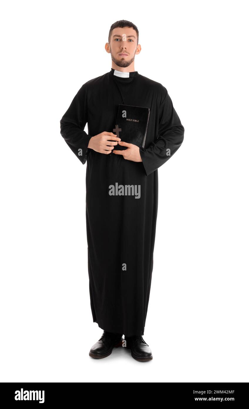 Young priest with Holy Bible on white background Stock Photo - Alamy