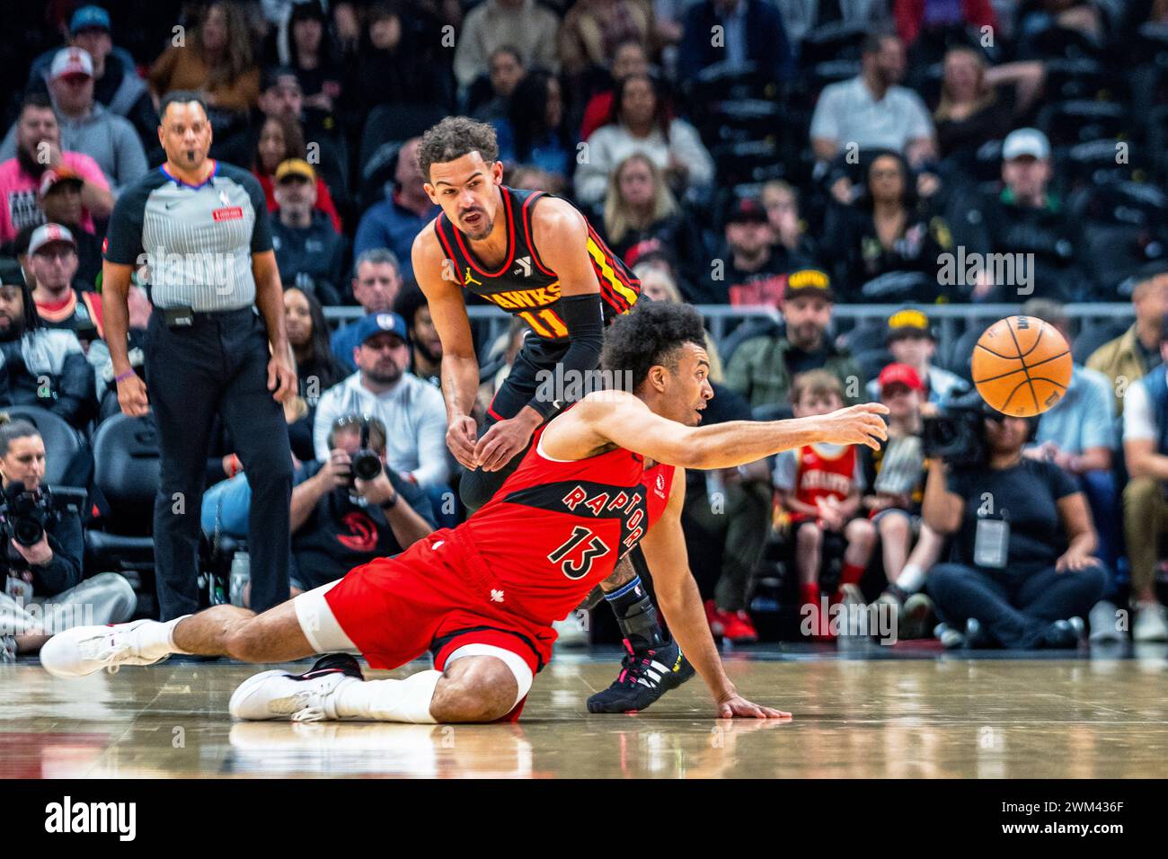 Toronto Raptors forward Jordan Nwora (13) passes the ball after falling ...
