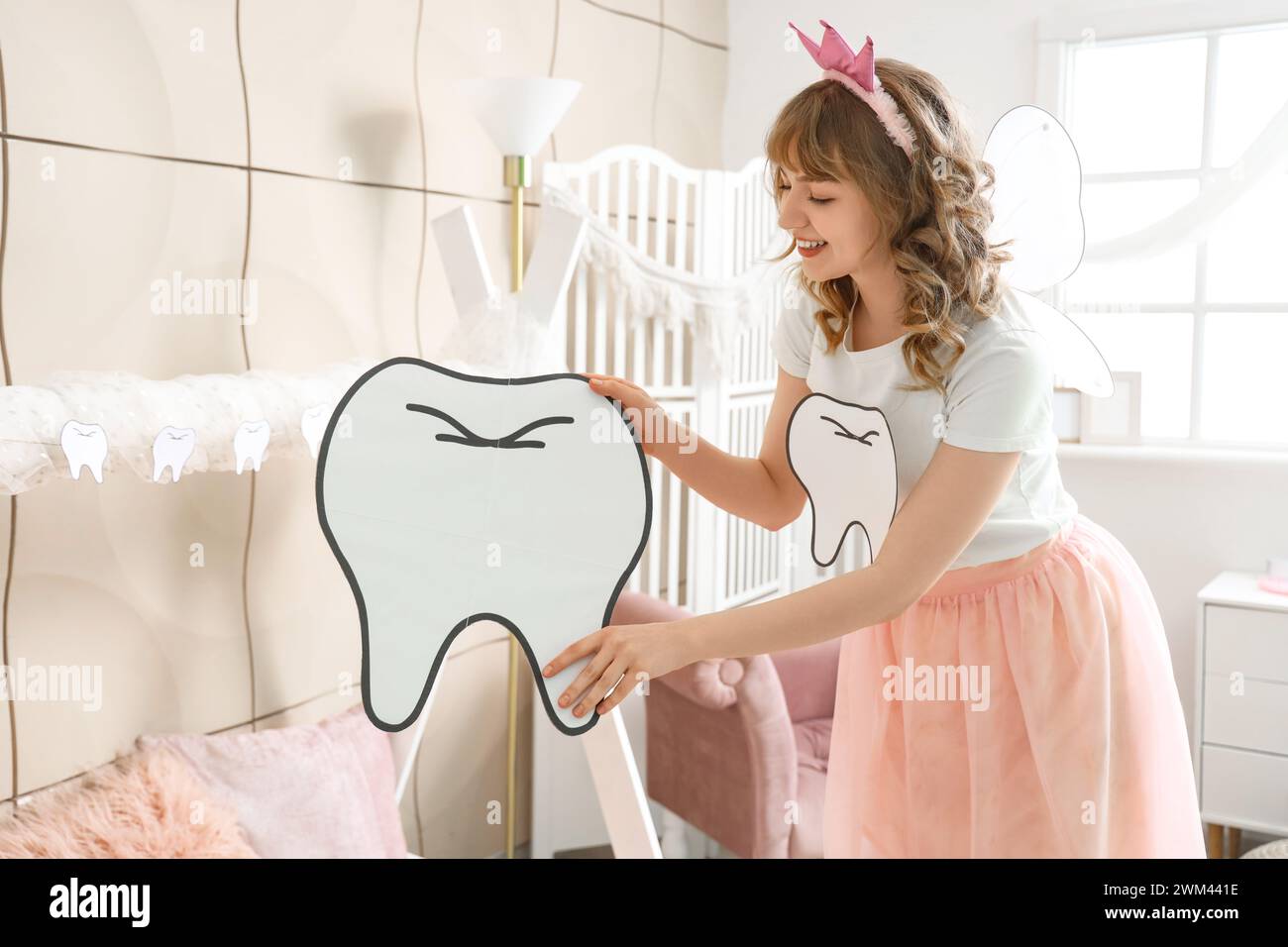 Tooth Fairy with paper figure in children's bedroom Stock Photo - Alamy