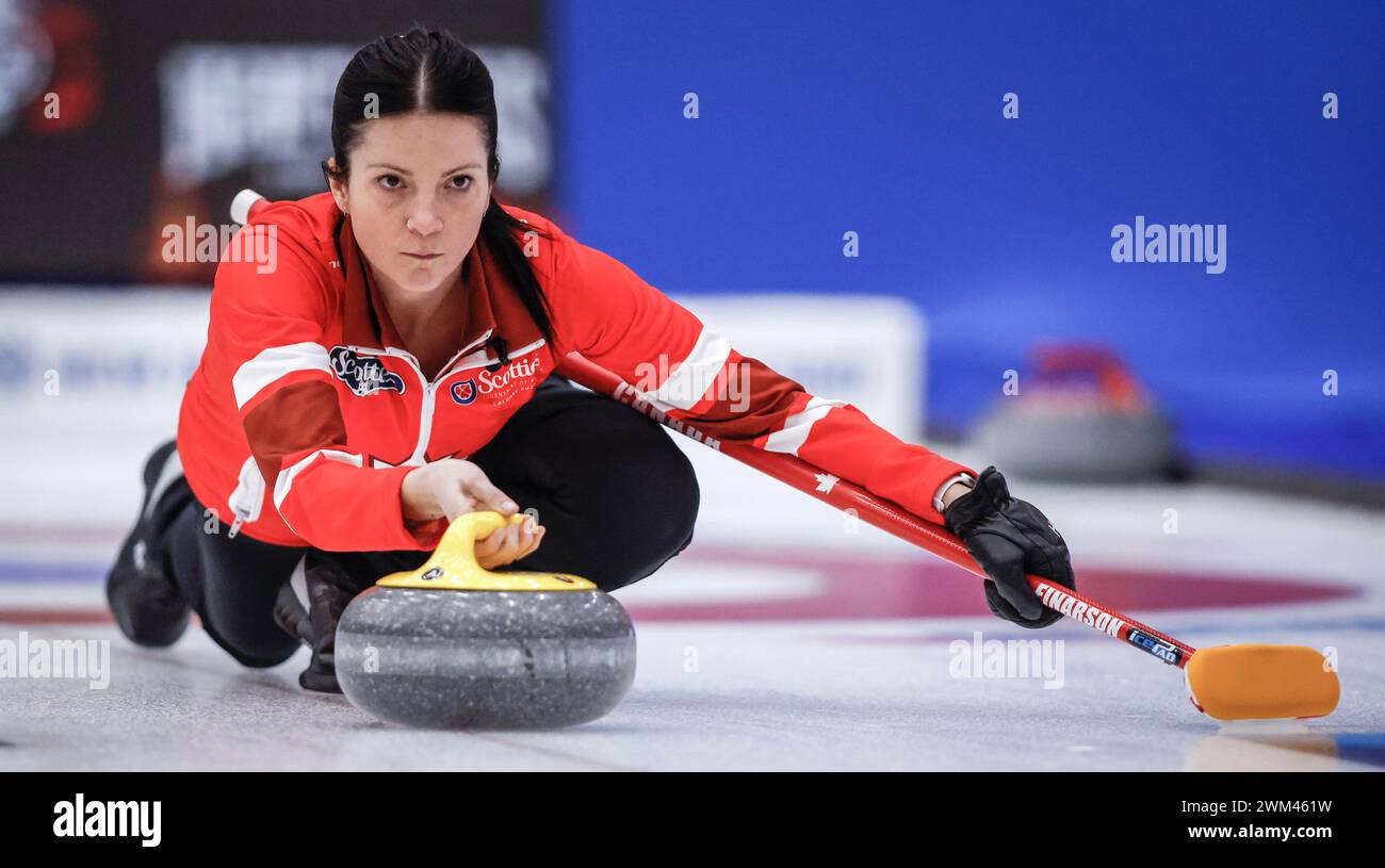 Team Canada skip Kerri Einarson delivers a stone as they play Team ...